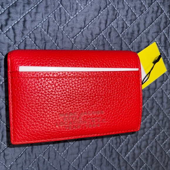 Marc Jacobs | Bags | Marc Jacobs Logo Embossed Small Bifold Wallet ...